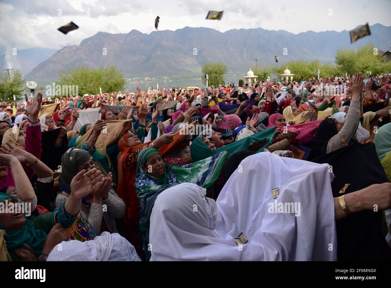 Kashmiri Muslim devotees seen raising their hands while beseeching for ...