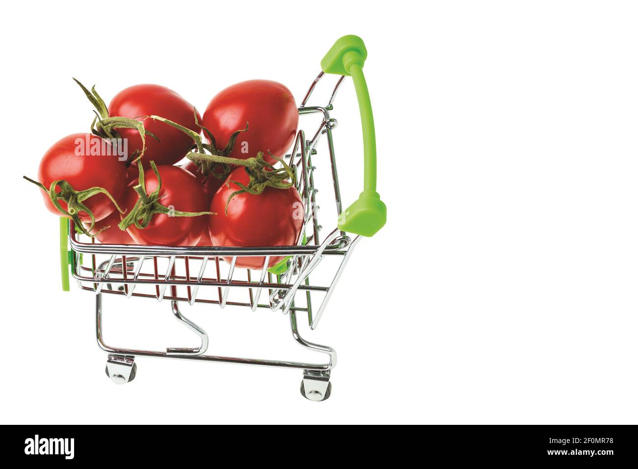 Close up view of red tomatoes in shopping cart on white background ...