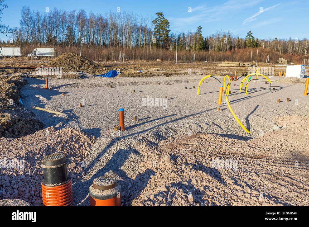 Beautiful view of construction site with forest trees and blue sky on ...