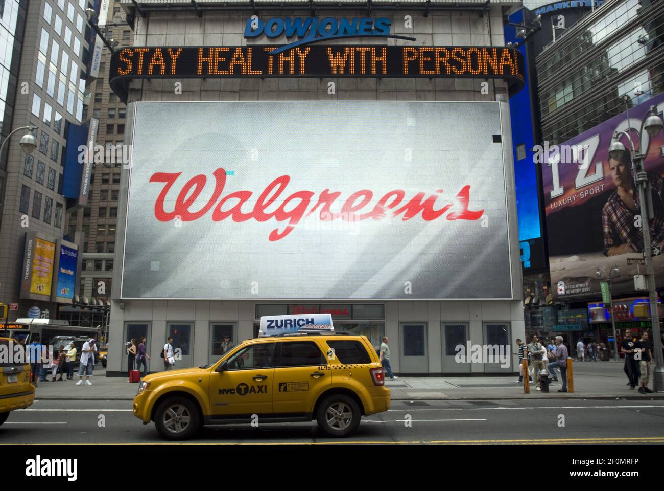 A giant illuminated sign on One Times Square in New York advertises the ...