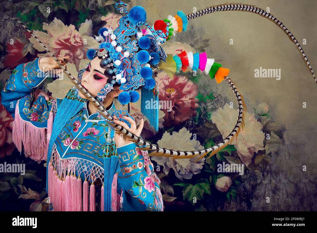 A tourist wearing Sichuan Opera costume poses for photos in Chengdu ...