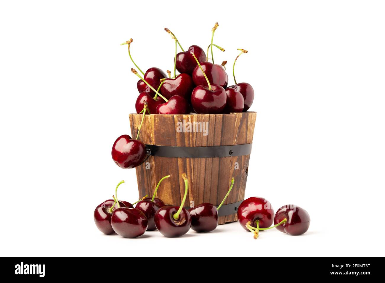 Berry Cherry in wooden round barrel pot on white background Stock Photo ...