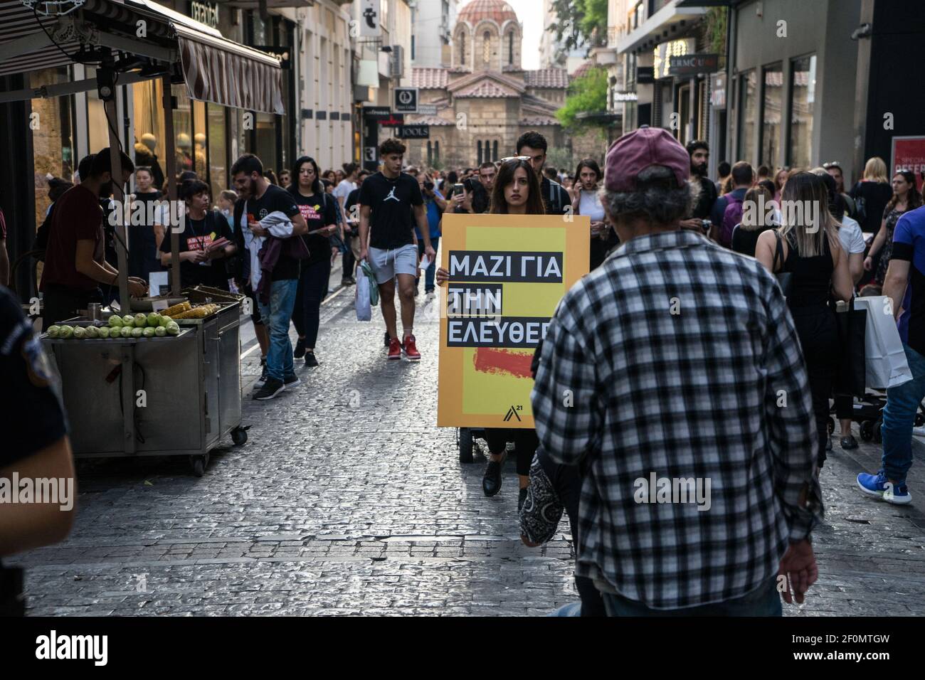 Participants march through a pedestrian street during the parade. Walk ...