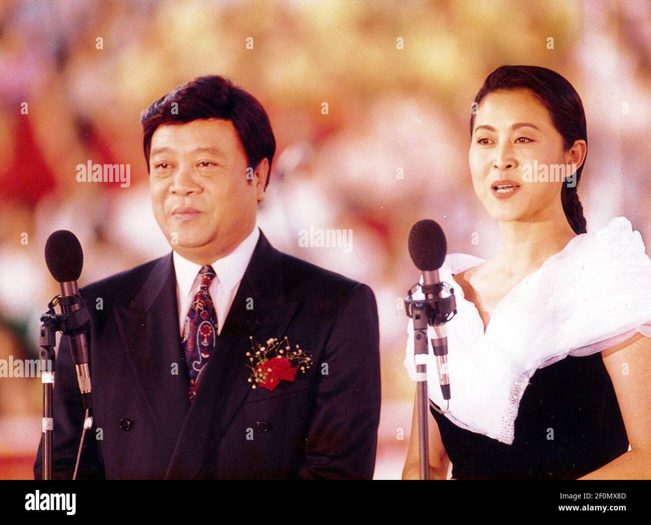 In this unlocated photo, Chinese news anchor Zhao Zhongxiang, left, and ...