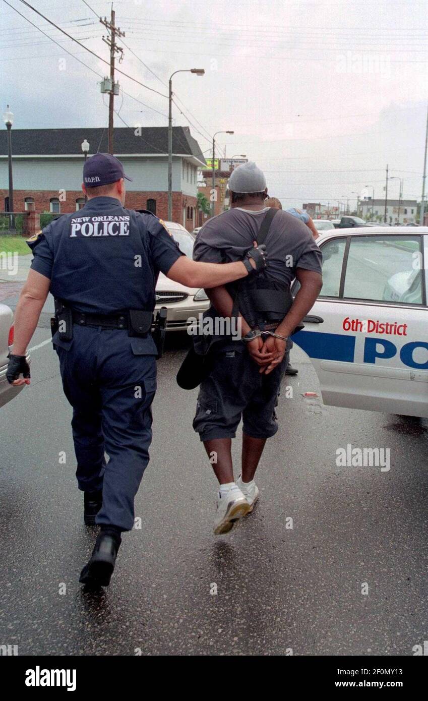 August 2003 - New Orleans, Louisiana - Police lead away murder suspect ...