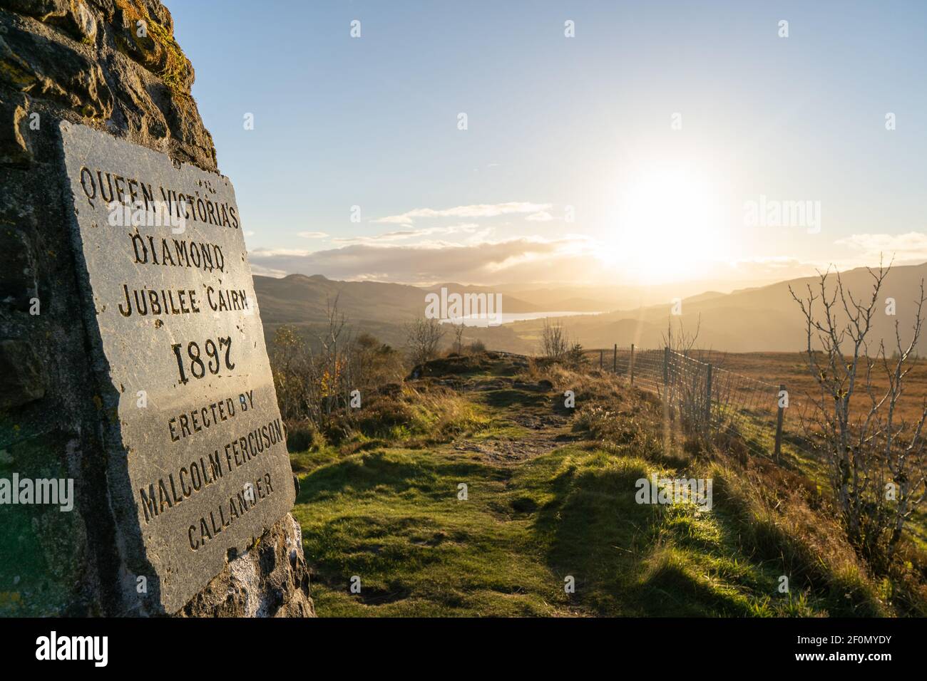1897 Queen Victoria Diamond Jubilee cairn plaque with sunset on the ...