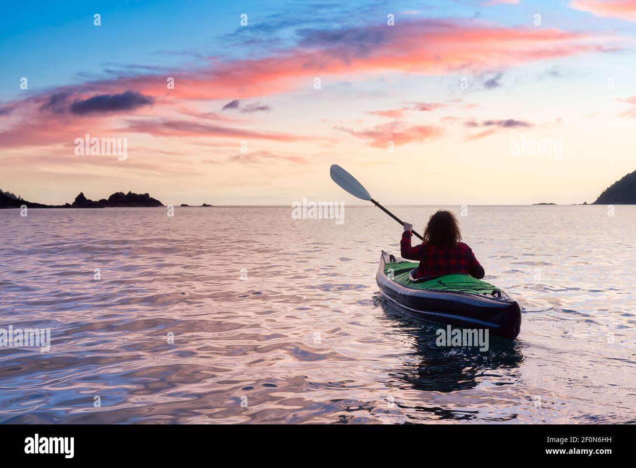 Adventurous Girl kayaking in the Pacific Ocean Stock Photo - Alamy