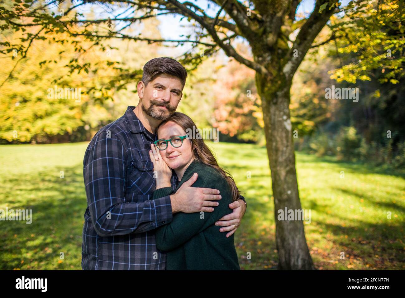Outdoor portrait of a millennial aged couple embracing Stock Photo - Alamy