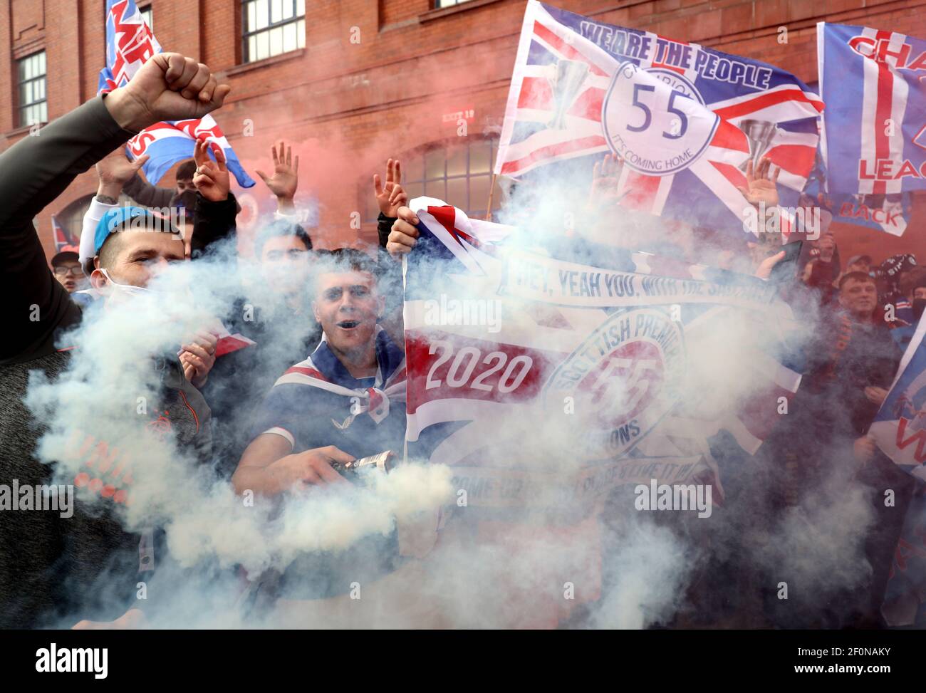 Rangers fans celebrate outside of the Ibrox Stadium after Rangers win ...