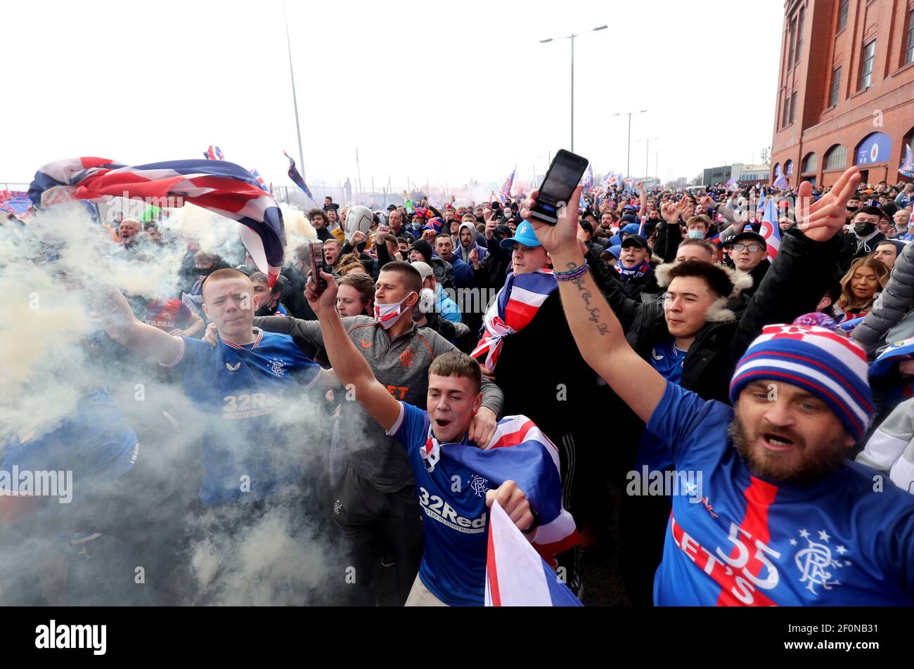Rangers fans celebrate outside of the Ibrox Stadium after Rangers win ...