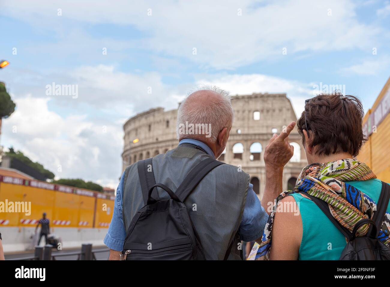 Back view of a couple going at Colosseum in Rome, Italy Stock Photo - Alamy