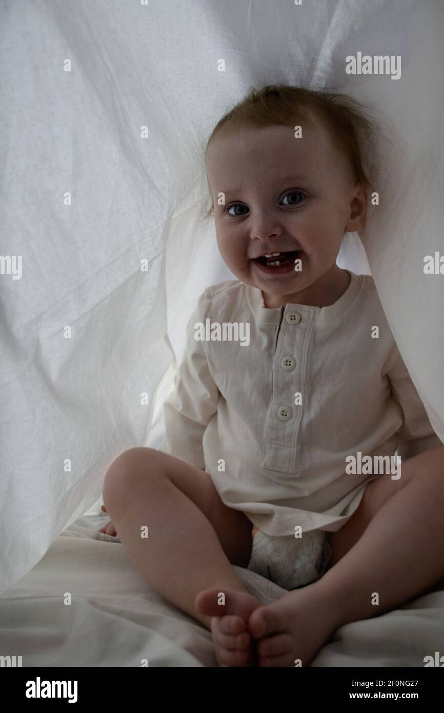 Girl hiding kids hi-res stock photography and images - Alamy