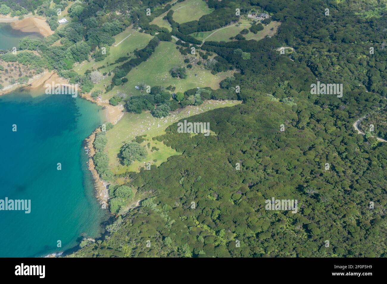 Aerial image of bush clad landscape and coastal bay area of Great ...