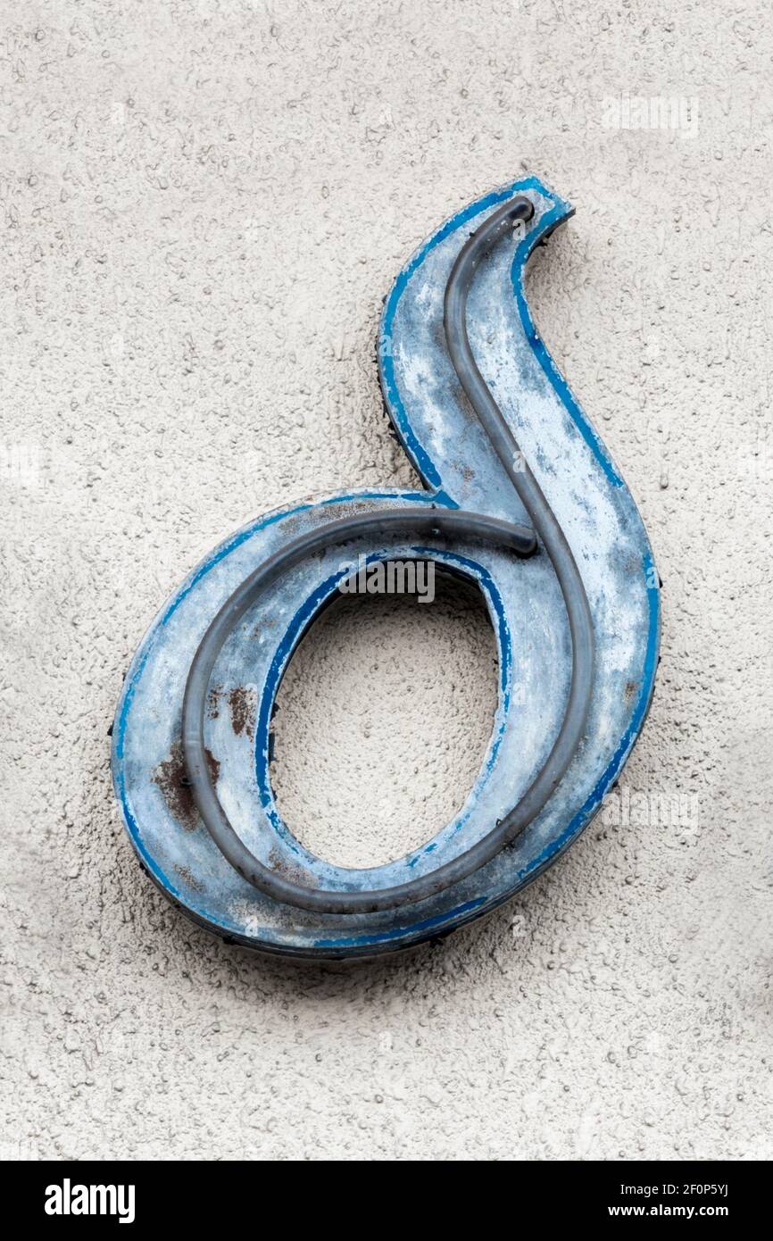 Remains of a old blue neon letter d Stock Photo - Alamy