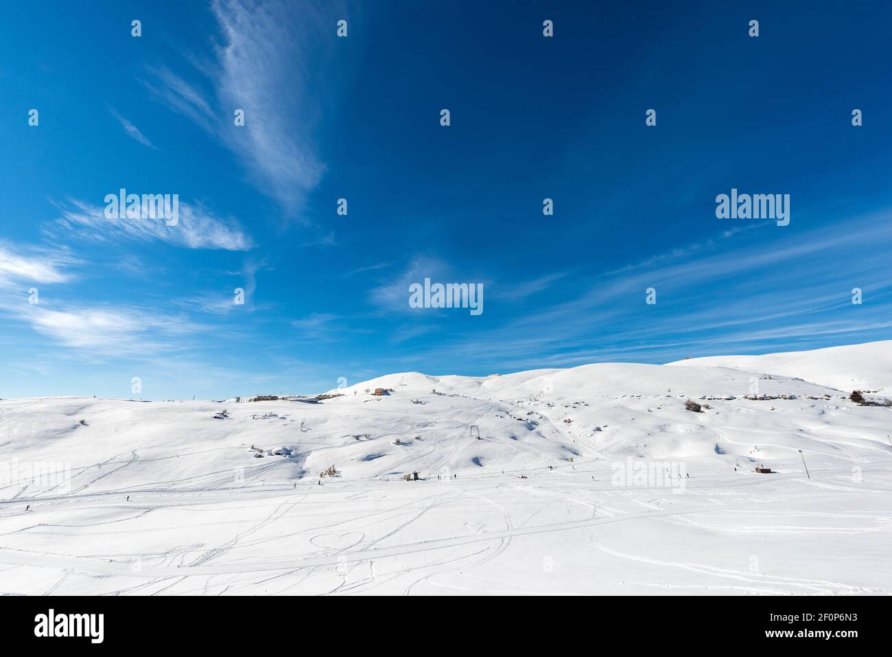 Malga San Giorgio ski resort in winter with snow and Monte Tomba ...