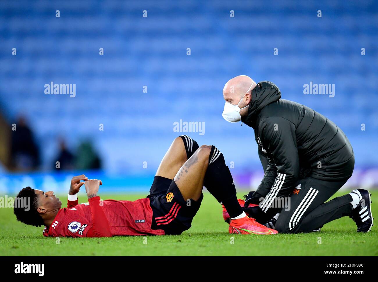 Manchester United's Marcus Rashford receives medical treatment after ...