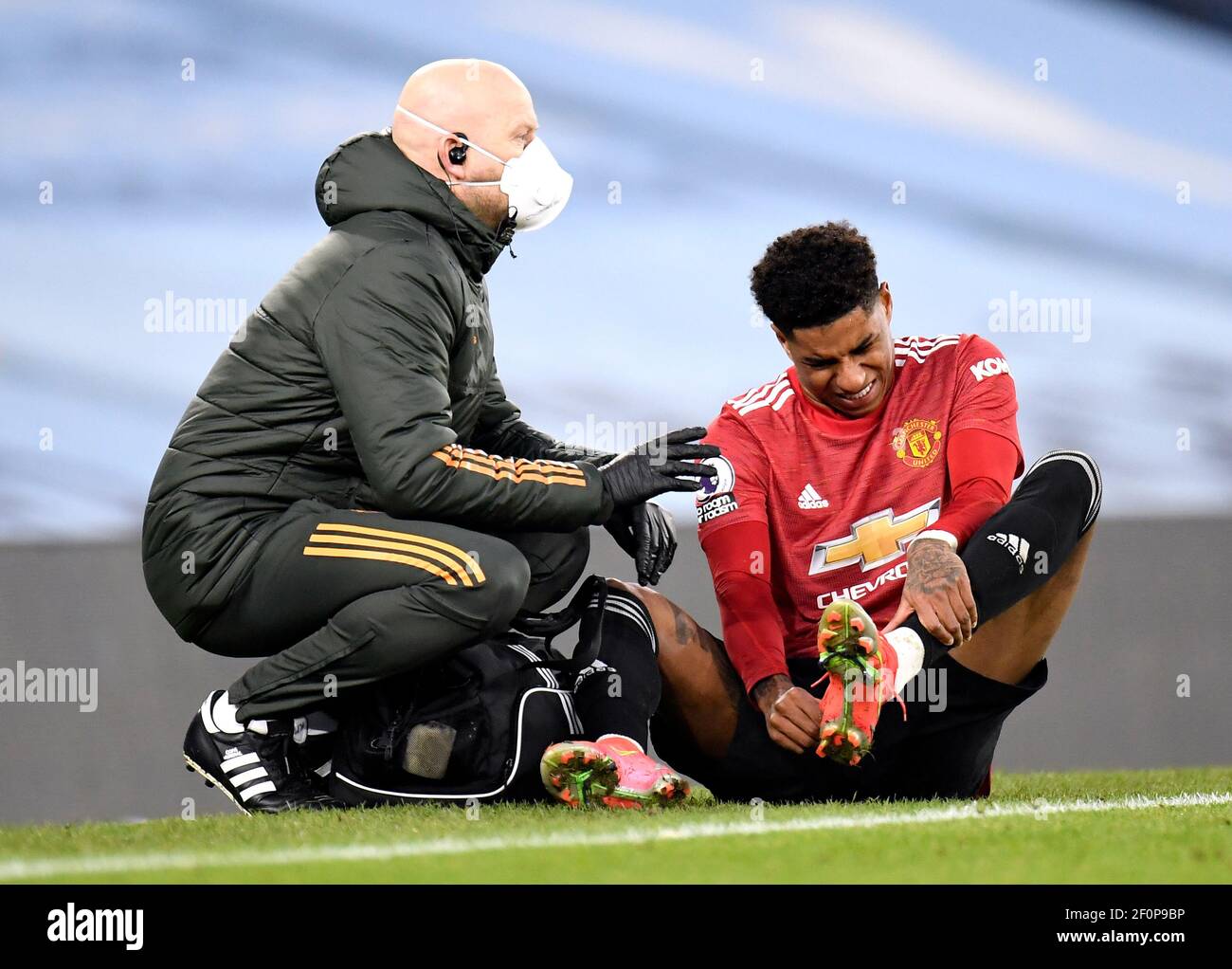 Manchester United's Marcus Rashford receives medical treatment after ...