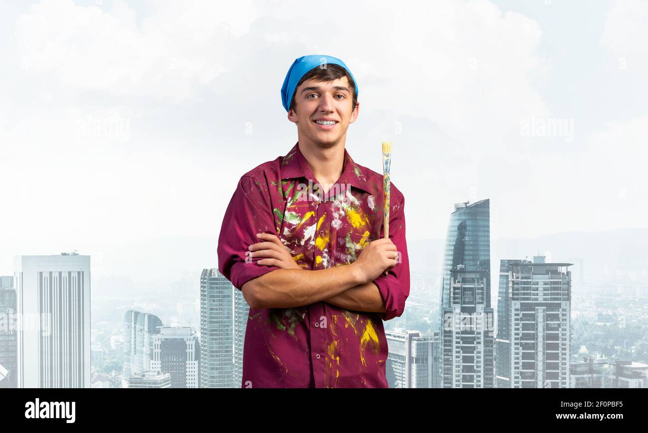 Smiling young painter hi-res stock photography and images - Alamy
