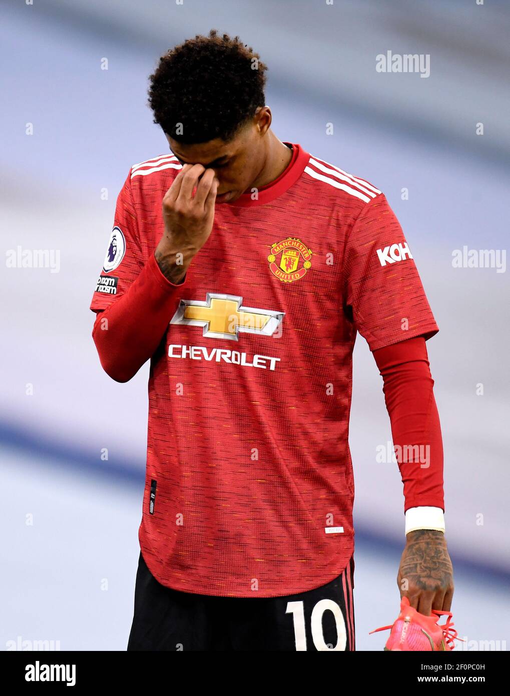 Manchester United's Marcus Rashford appears dejected as he leaves the ...