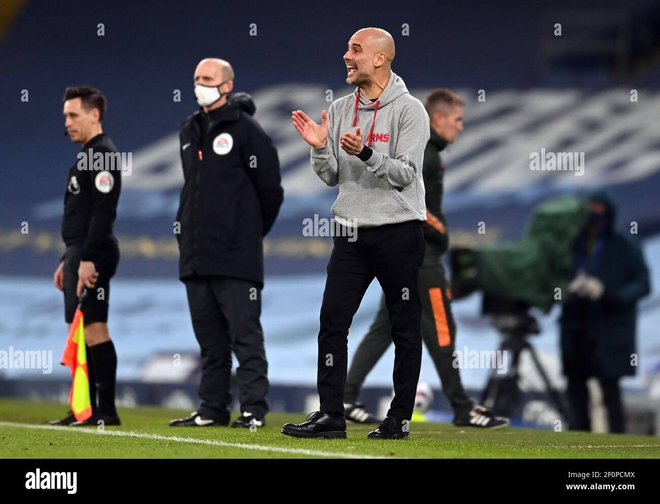 Manchester City manager Pep Guardiola (right) gestures on the touchline ...