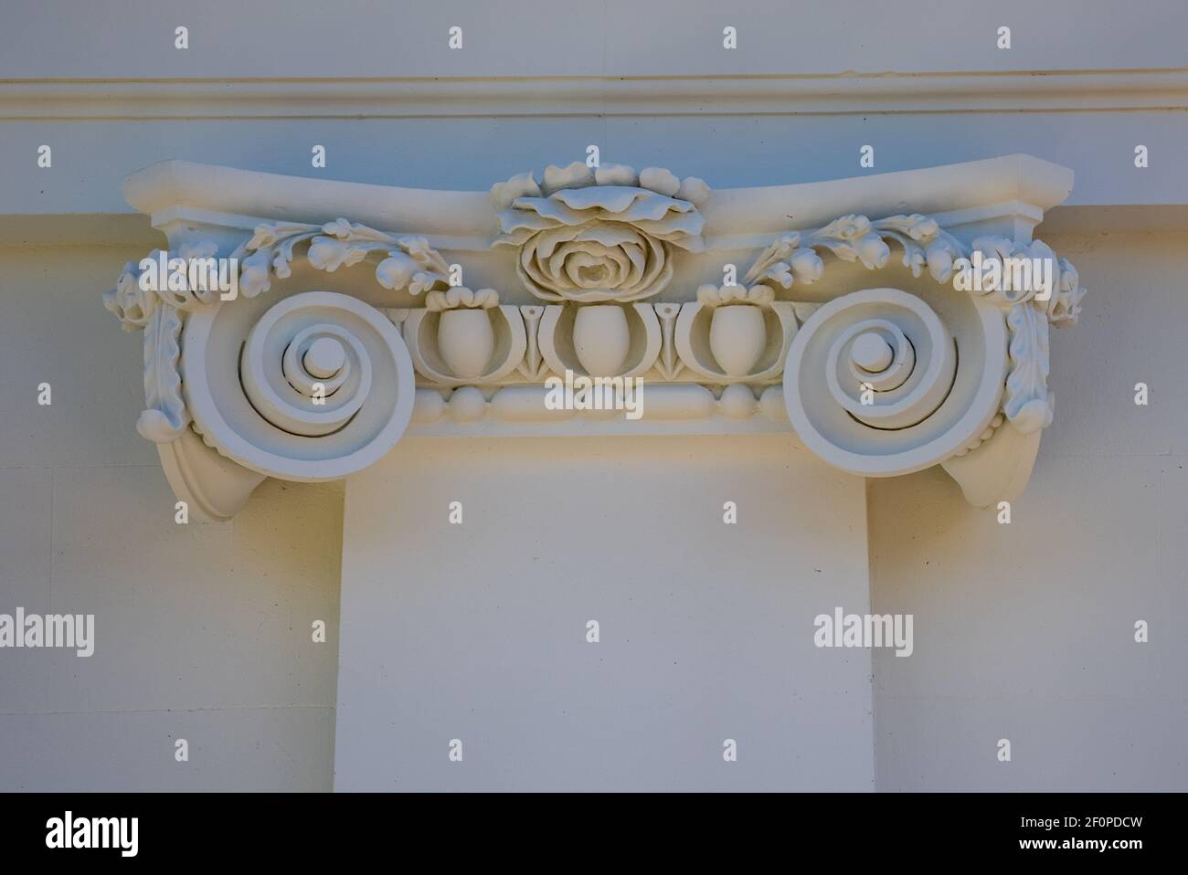 Stone swag and carvings are seen above the windows and columns of the ...