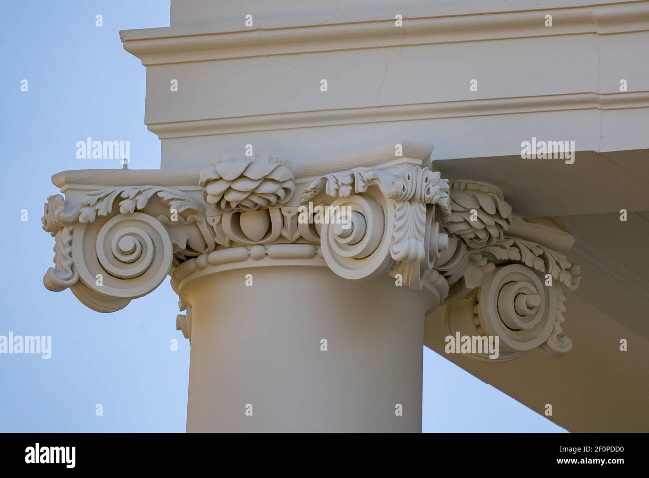 Stone swag and carvings are seen above the windows and columns of the ...