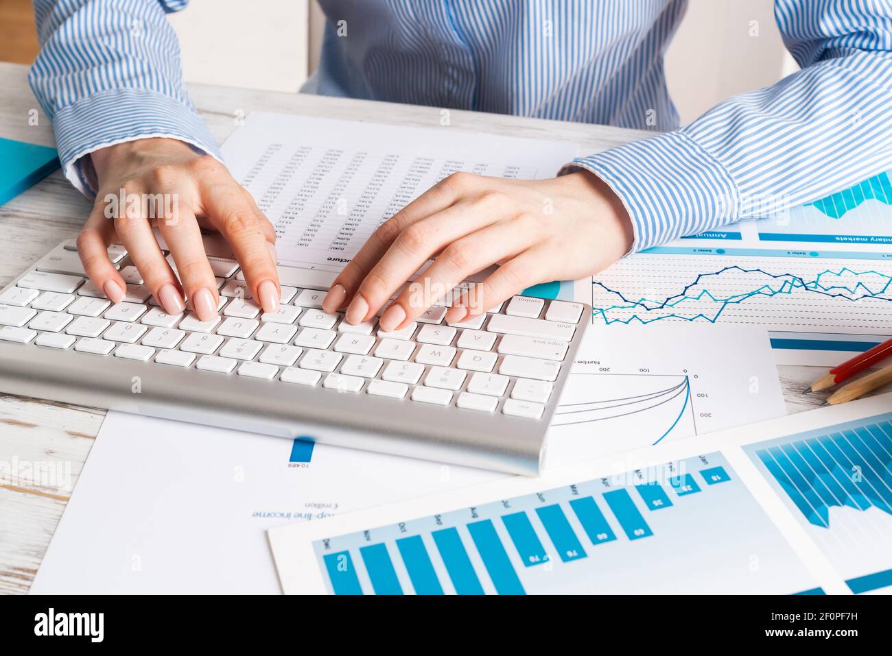 Manager typing on computer keyboard Stock Photo - Alamy