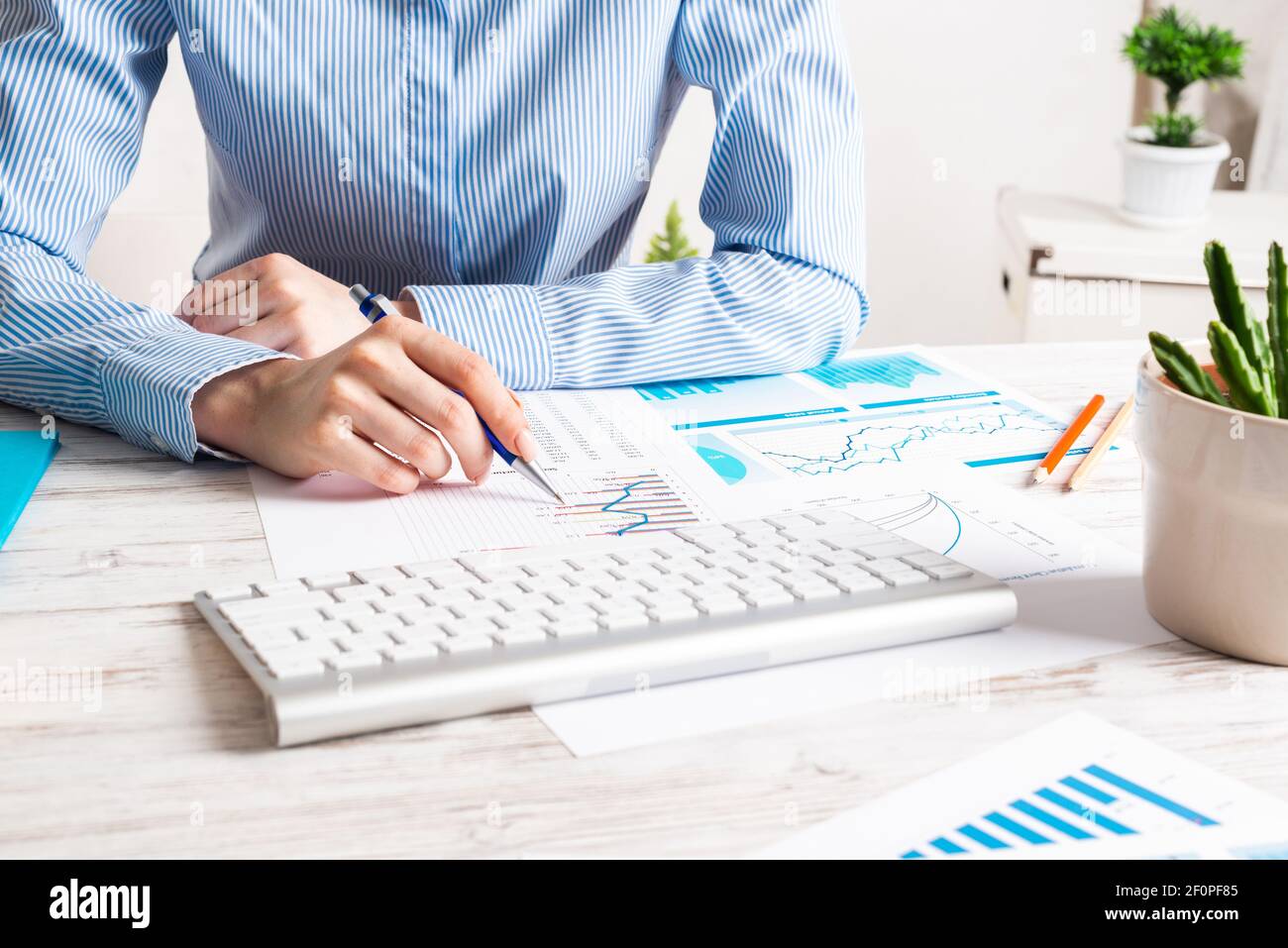 Business consultant sitting at desk Stock Photo - Alamy