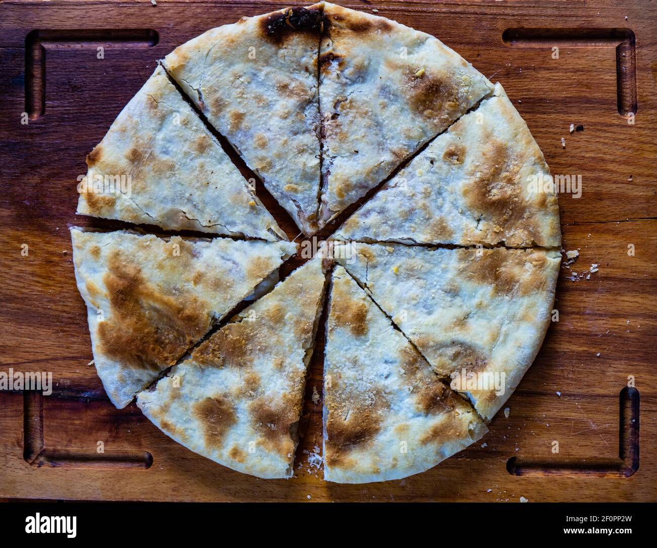 Traditional georgian bread Lobiani served on wooden board Stock Photo ...