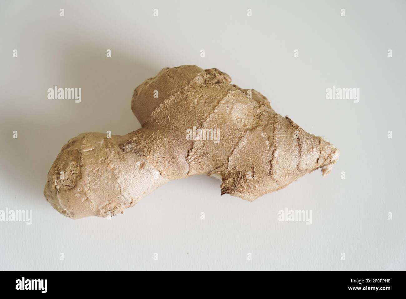 fresh ginger isolated on a white background Stock Photo - Alamy