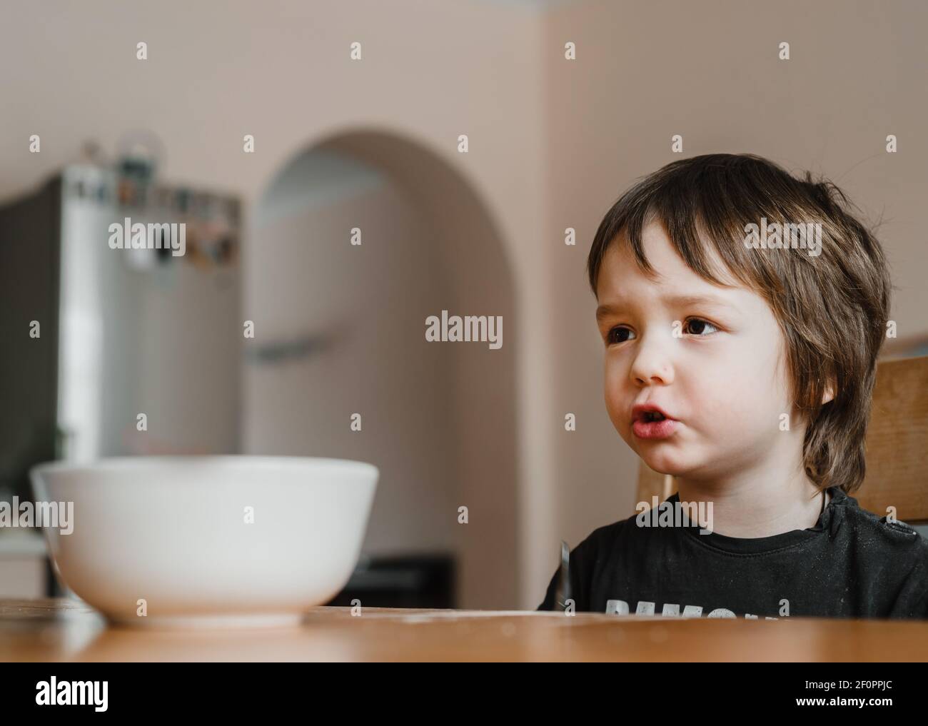 A little boy doesn't want to eat his breakfast Stock Photo - Alamy
