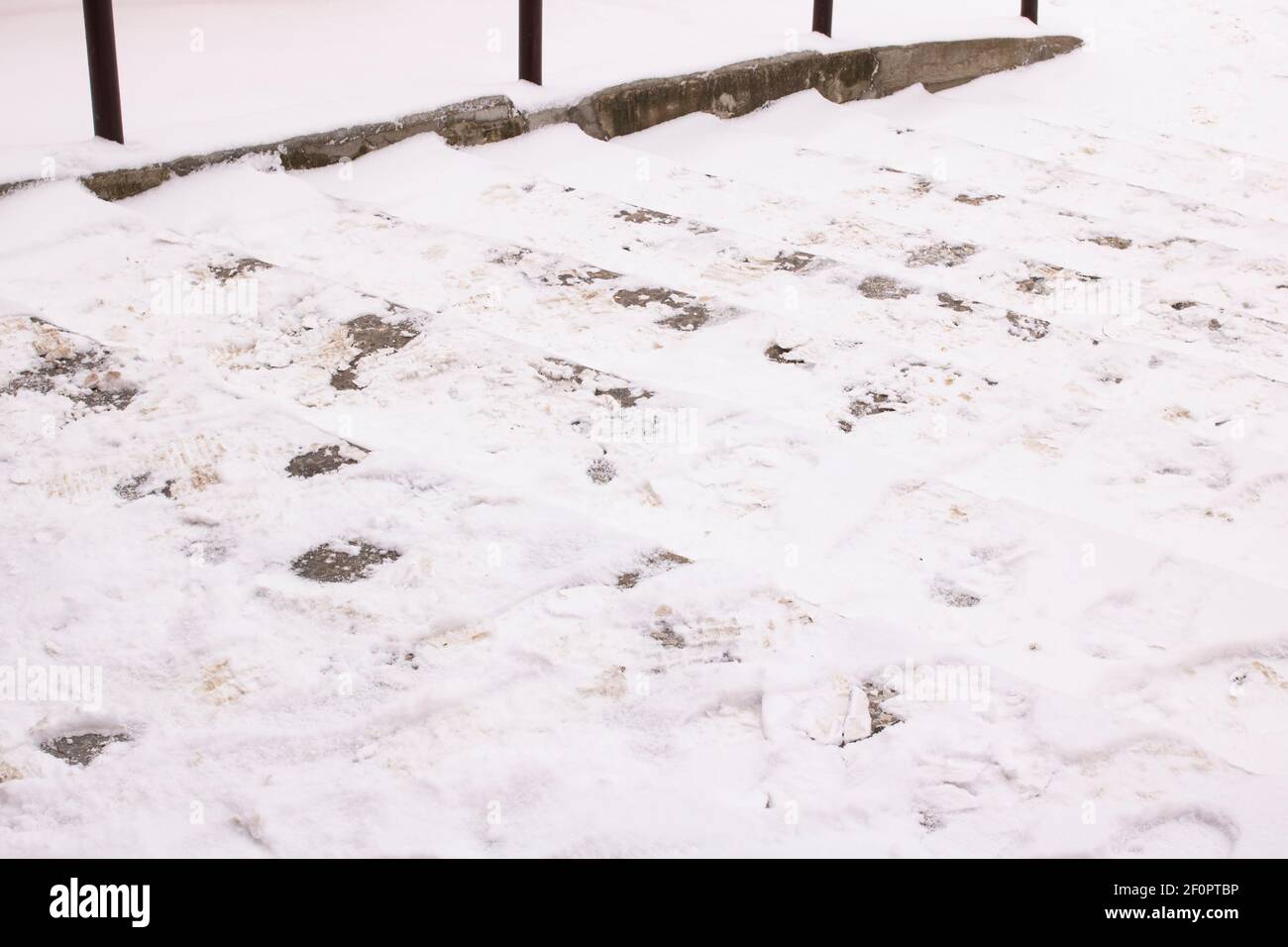Snow and boot marks on the steps close up Stock Photo - Alamy