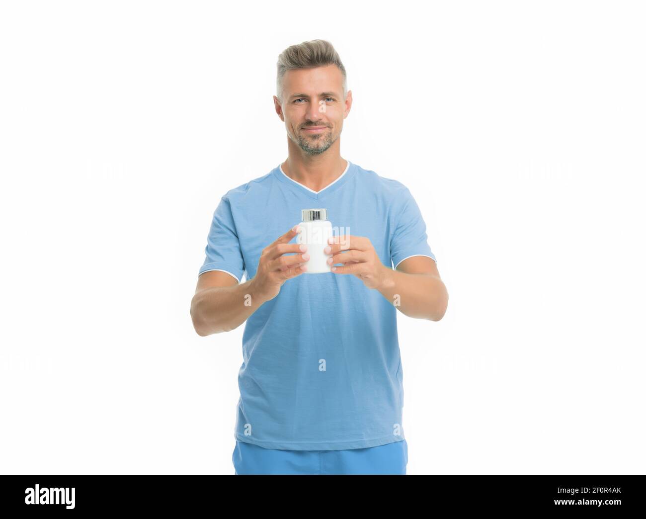 Medicines concept. Health is wealth. Bearded man holding vitamin pill ...