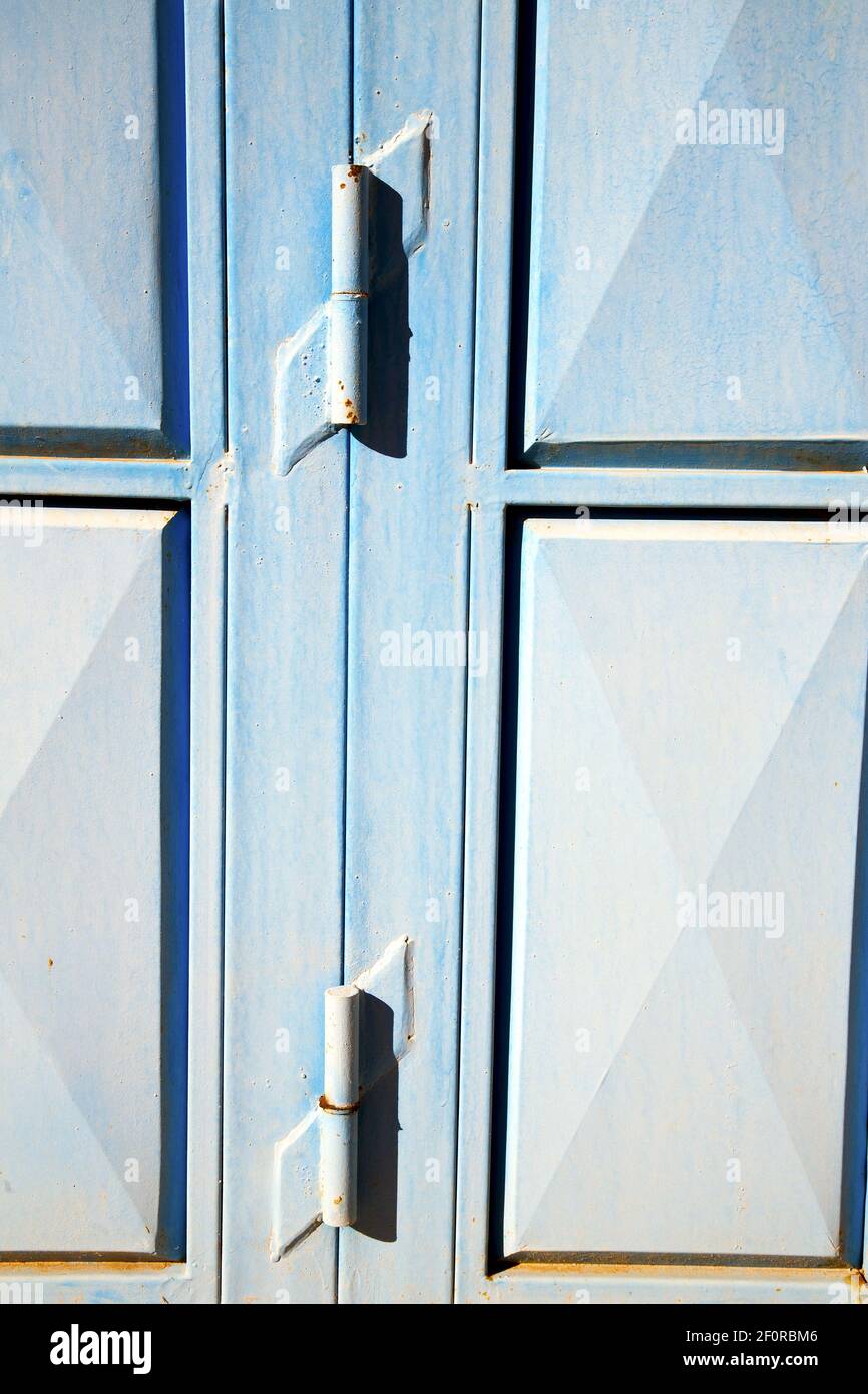 Blue hinges o in africa the old wood facade Stock Photo - Alamy