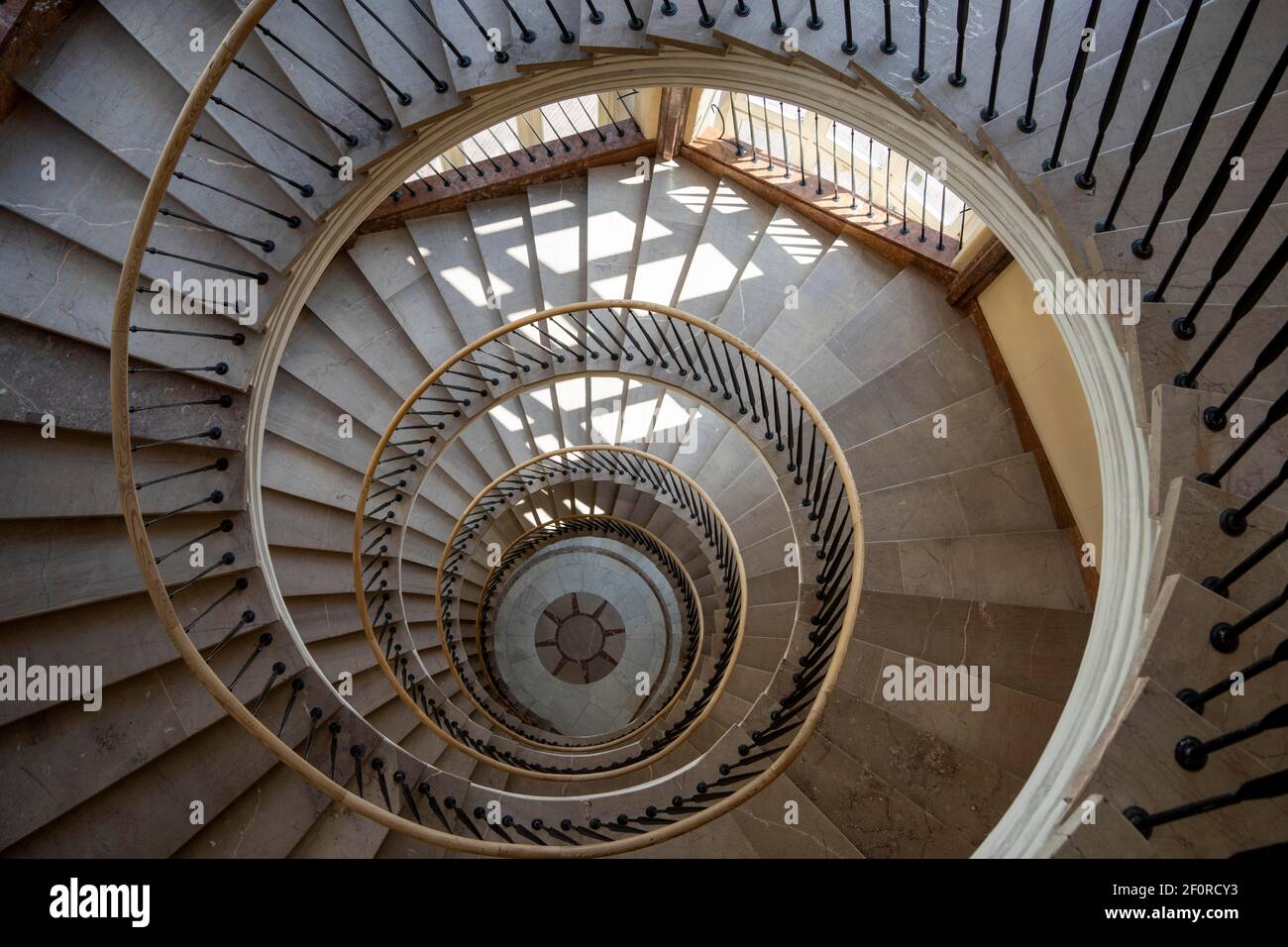 Beautiful winding staircase in old tenement house in Warsaw, Poland ...