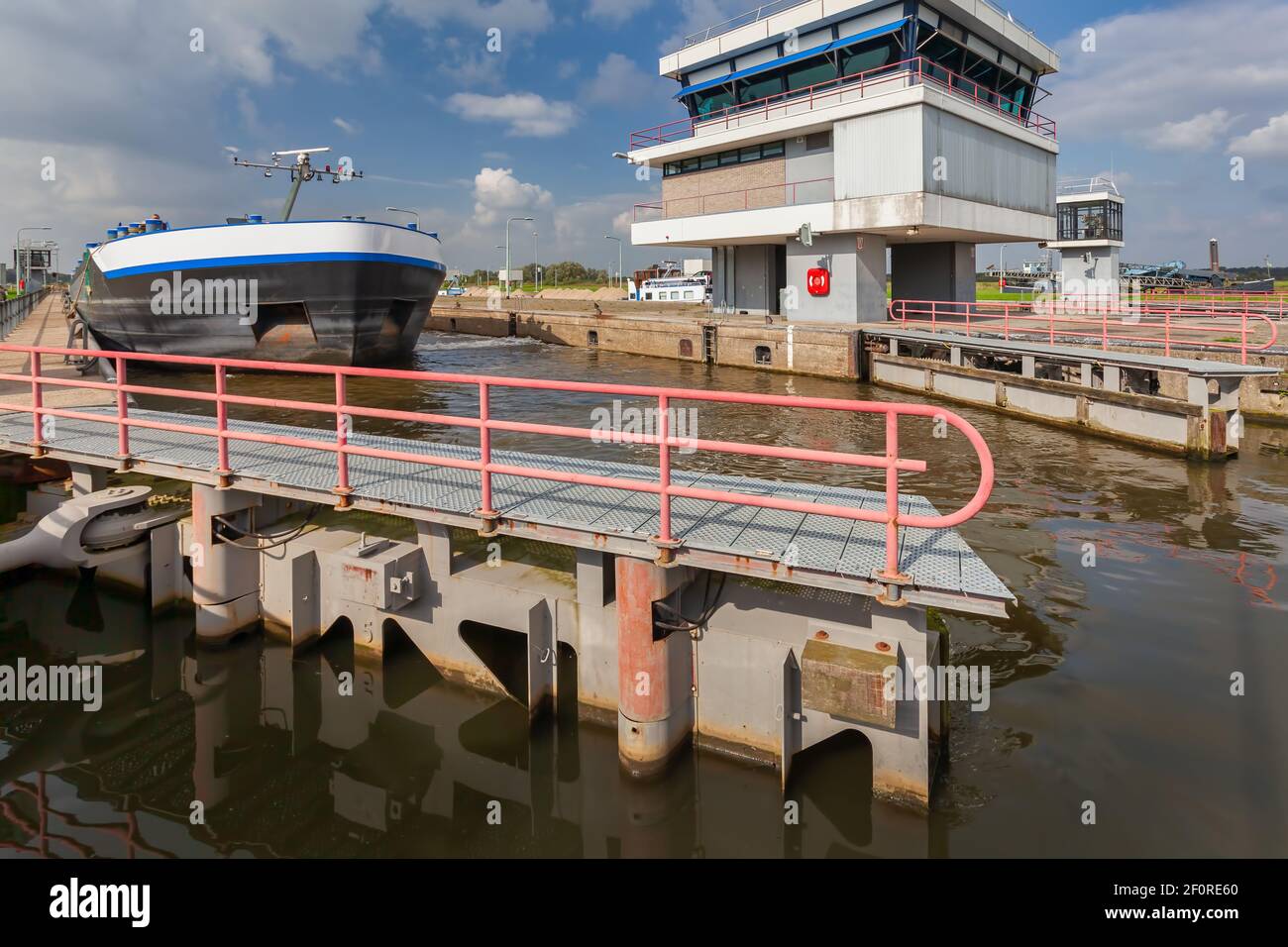Dutch open sluice with cargo ship waiting for passage Stock Photo - Alamy