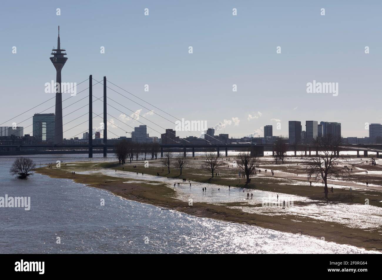 City panorama with flooded Rhine meadows, winter, Oberkassel bridge ...