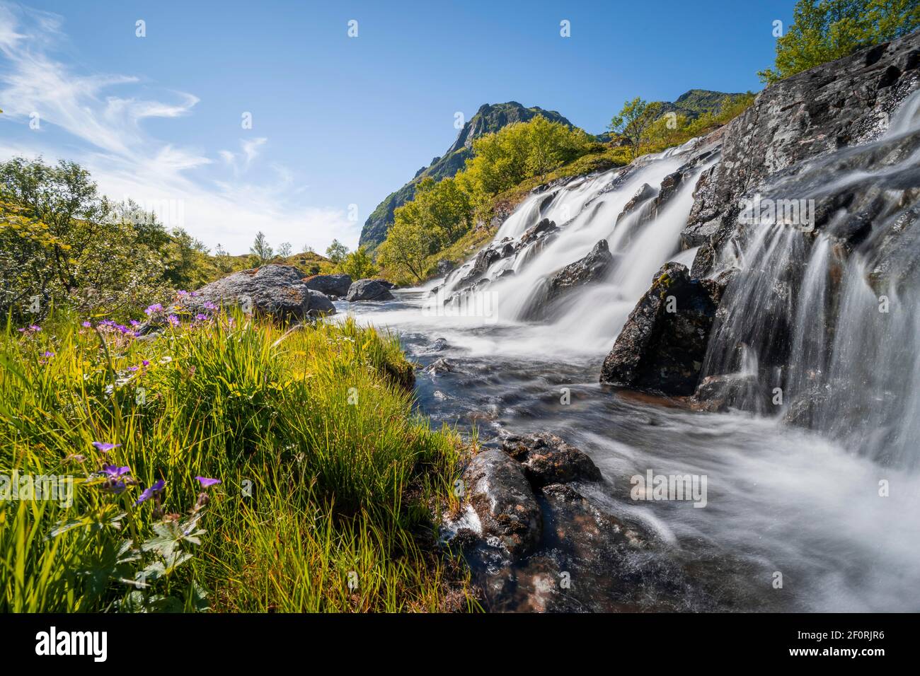 Waterfall near Sorvagen, mountain landscape with river, Moskenesoey ...