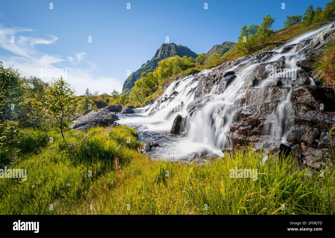 Waterfall near Sorvagen, mountain landscape with river, Moskenesoey ...