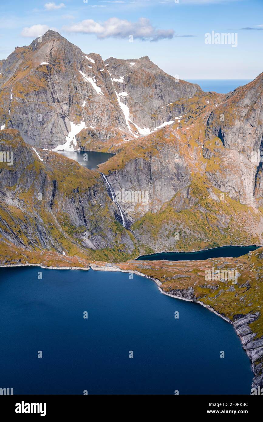 Mountain landscape with waterfall, lake Tennesvatnet and Litlforsvatnet ...