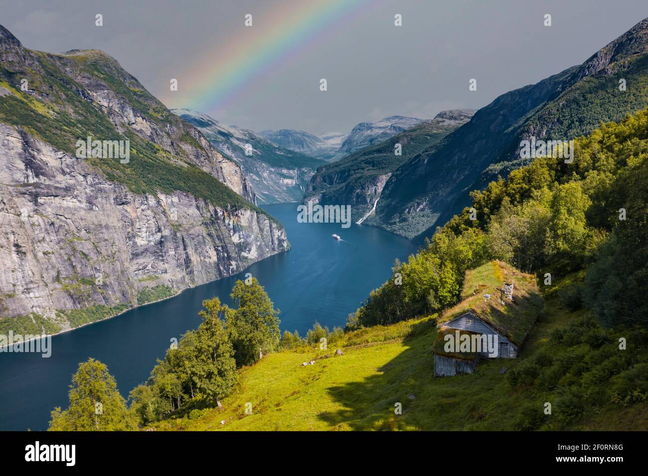 Blomberg Gard, Rainbow, historic mountain farm on steep mountainside ...