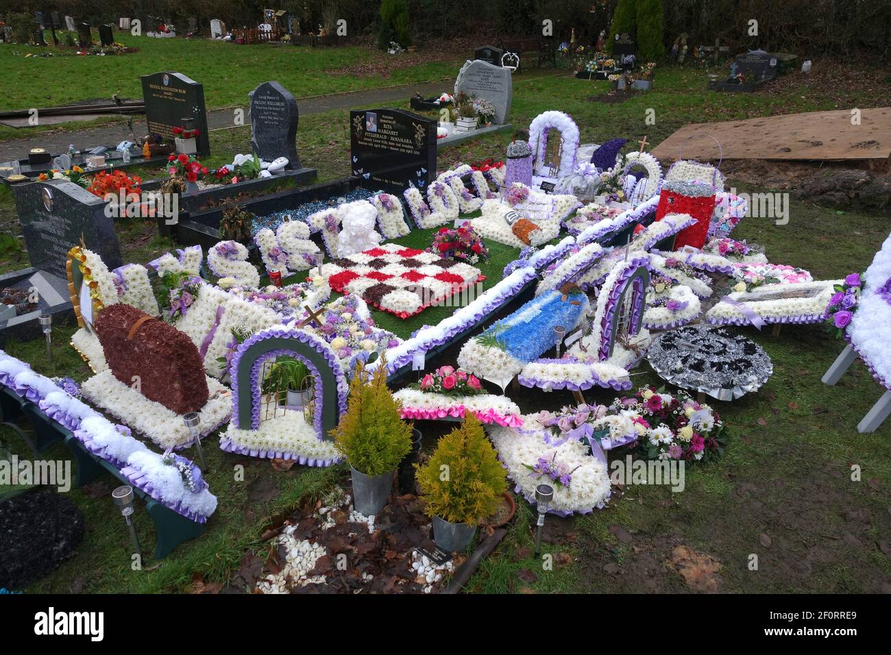 Floral tribute of wreaths at Gypsy graveside cemetery Britain, Uk 2021 ...