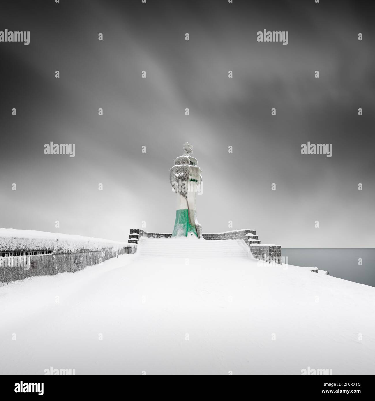 Iced lighthouse in the harbour of Sassnitz, Ruegen, Germany Stock Photo ...