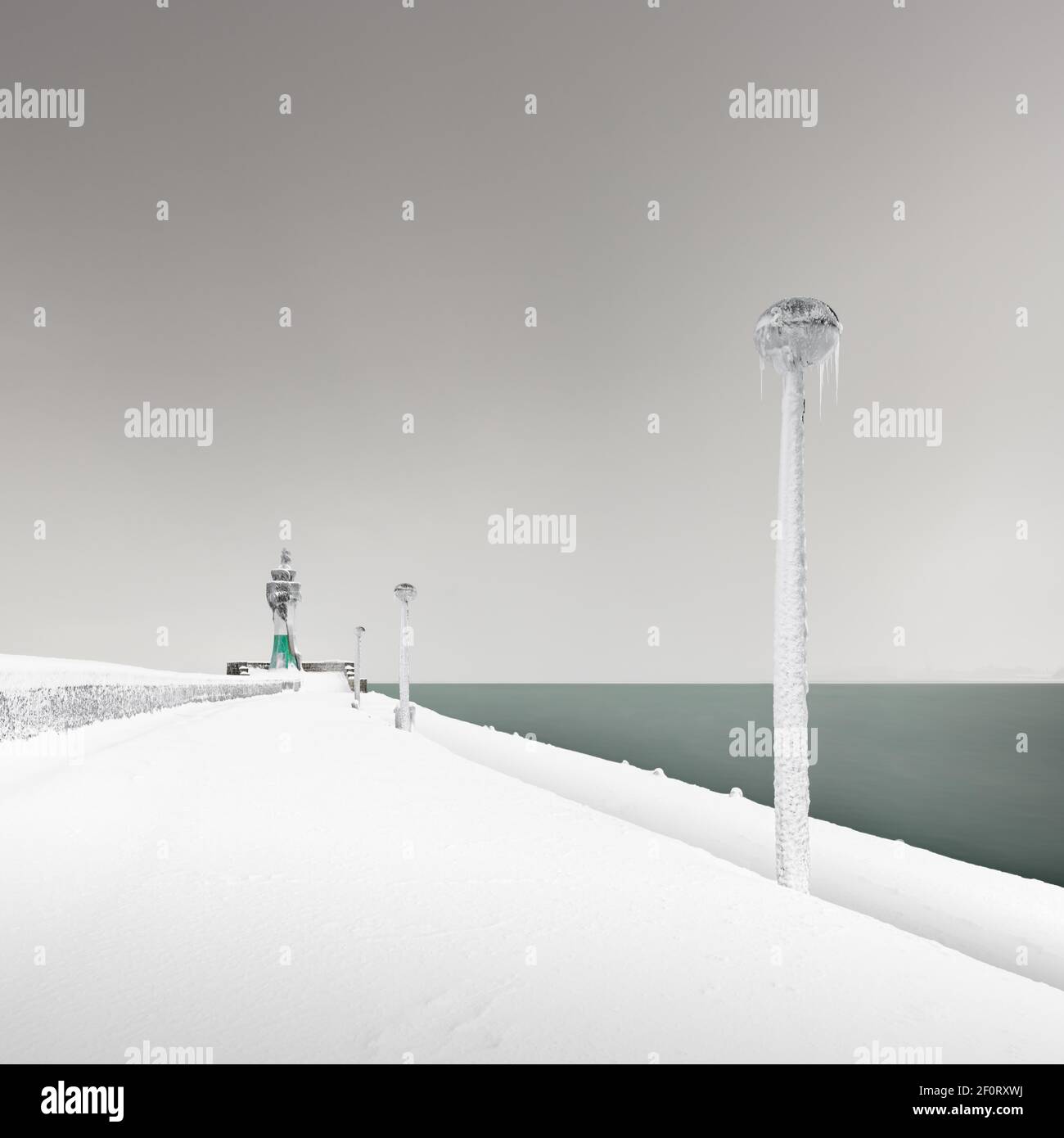 Iced lighthouse in the harbour of Sassnitz, Ruegen, Germany Stock Photo ...