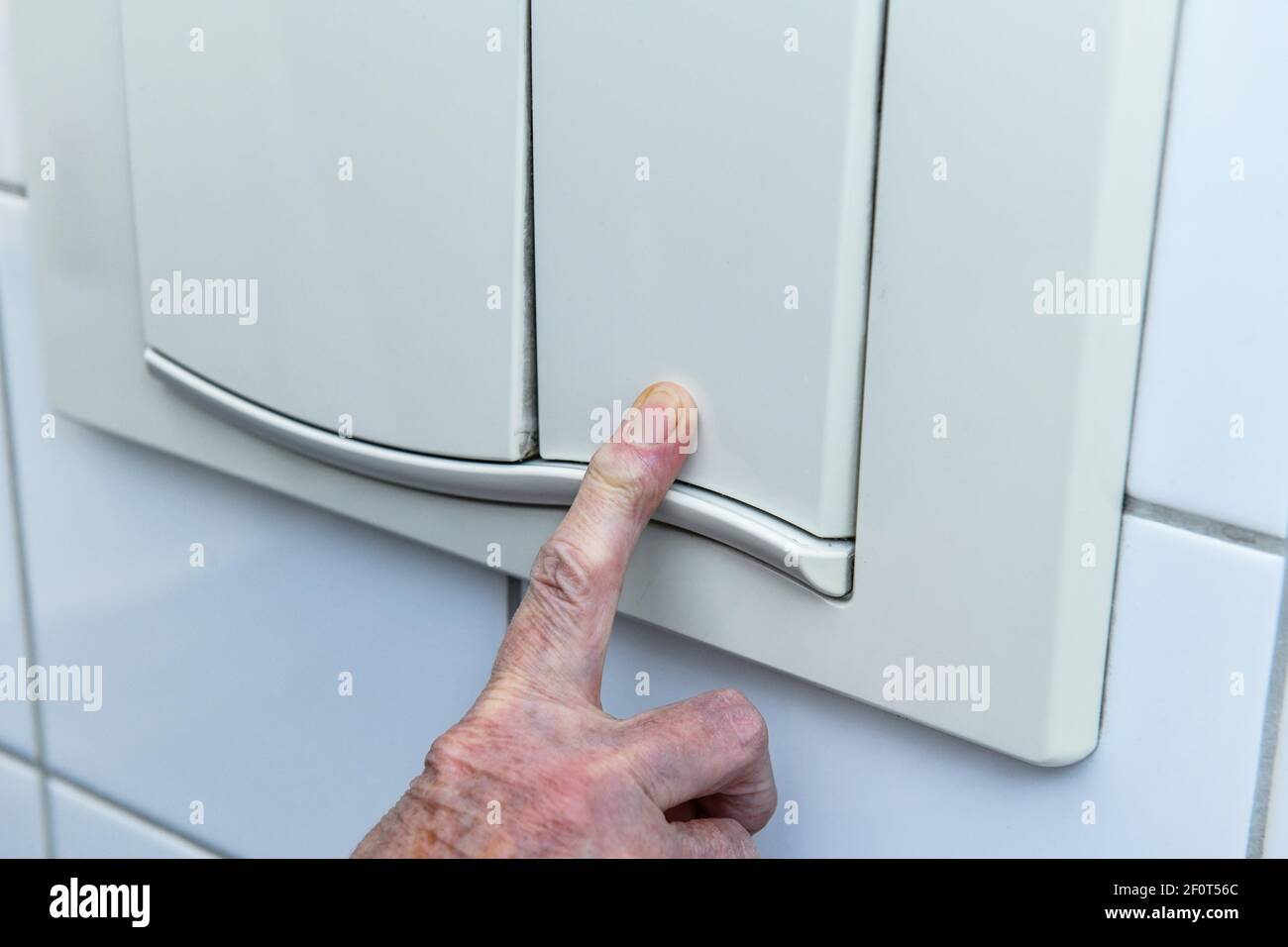 Hand flushing the toilet hi-res stock photography and images - Alamy