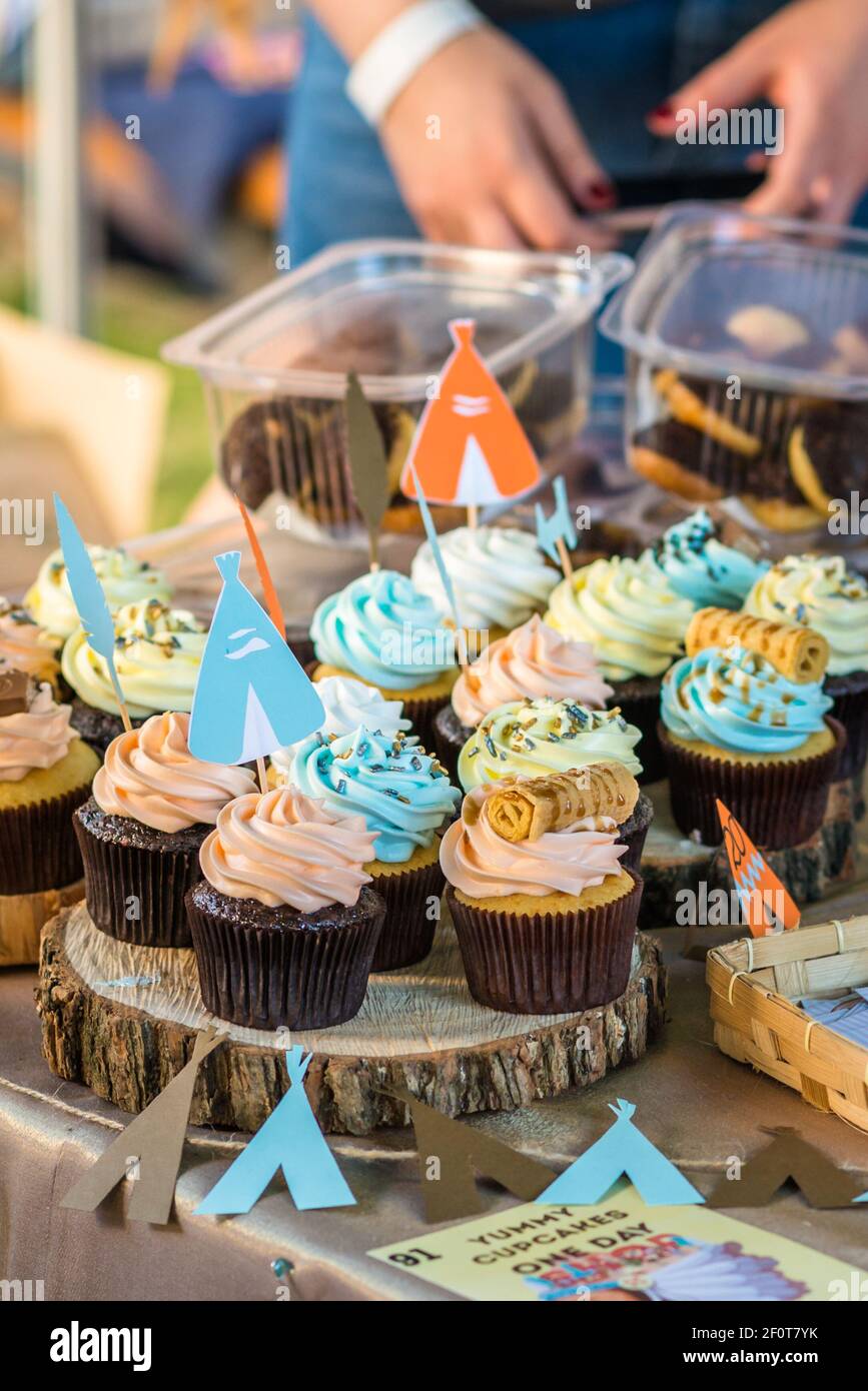 Delicious cupcakes with colored cream Stock Photo - Alamy