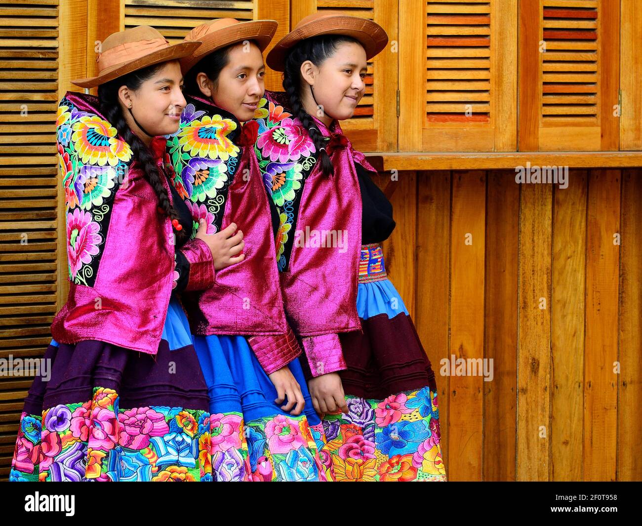 Three young indigenous girls pose in colorful costumes, Kuelap, Luya ...