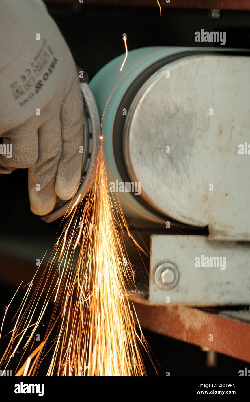 Work grinding hi-res stock photography and images - Alamy