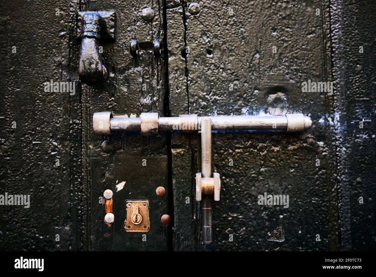 Detail of the ancient wooden door with locks Stock Photo - Alamy