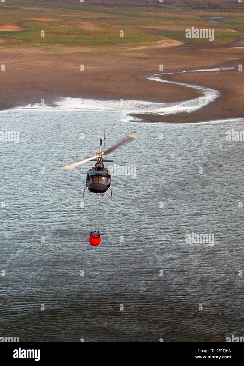 23 October 2007 - San Diego, California - A civilian helicopter refills ...